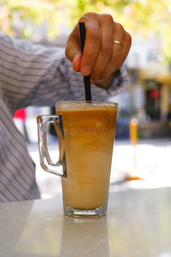 Ice Latte Coffee with a Straw on the Table. Stock Image - Image of ...