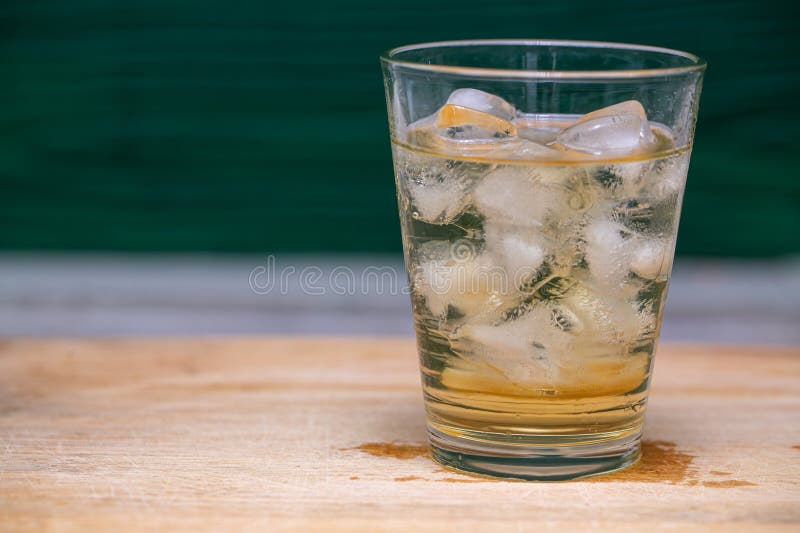 Ice Liquid in the Glass. Ice Cube Stock Photo - Image of fresh, brandy ...