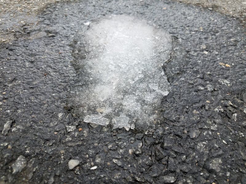 Ice Melting on Black Asphalt or Pavement Stock Photo - Image of winter ...