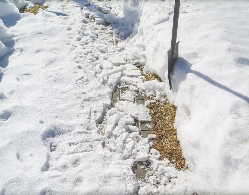 Ice melting on a footpath stock photo. Image of springtime - 243512220