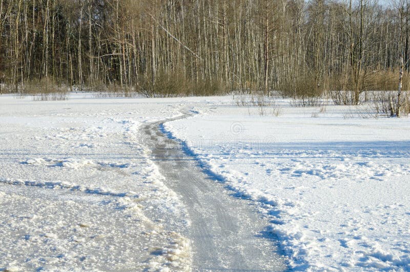Ice path on frozen lake stock photo. Image of environment - 37105066