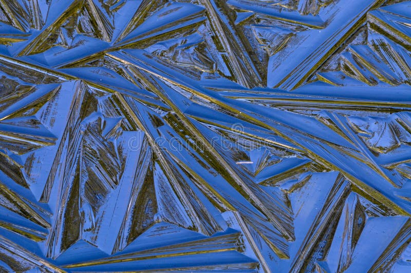 Pattern in Ice in a Stream with a Reflection of Color from the Sky ...