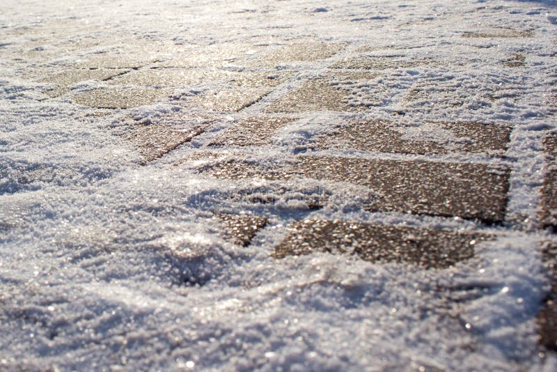 Ice on the pavement stock photo. Image of detail, winter - 68988314