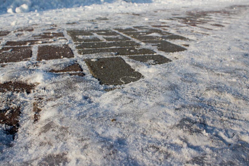 Ice on the pavement stock image. Image of closeup, brick - 68988363