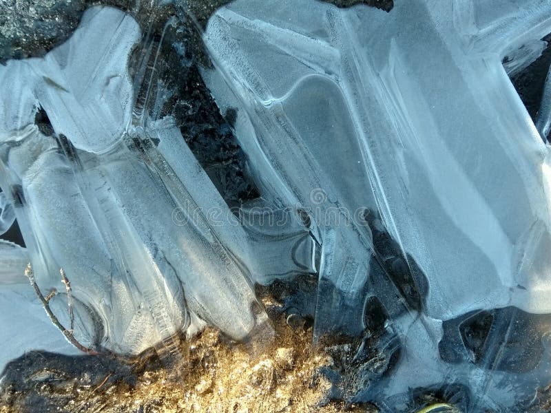 Ice on the puddle stock photo. Image of icicle, winter - 107393940