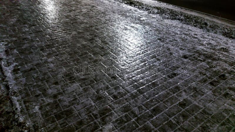 Ice and Reflection on the Sidewalk at Night in Winter. Reflection of ...