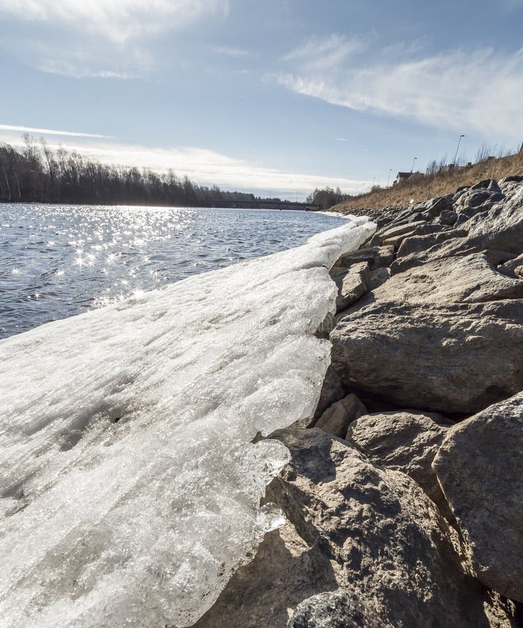 Ice and Rocks by River stock image. Image of water, cloudy - 70145747