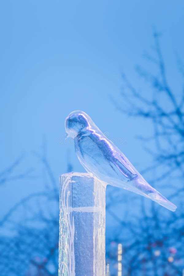 Ice Sculpture of a Bird Sitting on an Ice Pole, on a Blue Morning ...