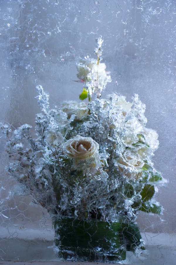 Ice Sculpture of Flowers in a Frozen Block of Ice Stock Image - Image ...