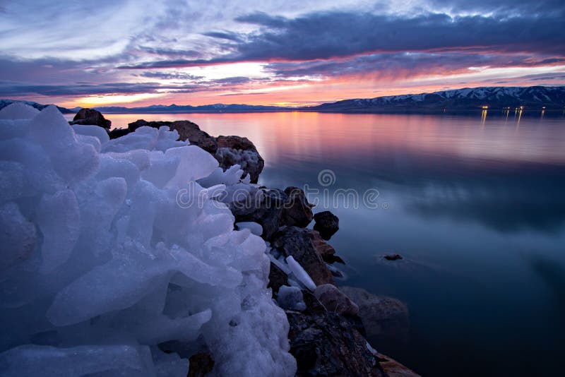 Ice on the Side of Utah Lake during Sunset with Glassy Water Stock ...