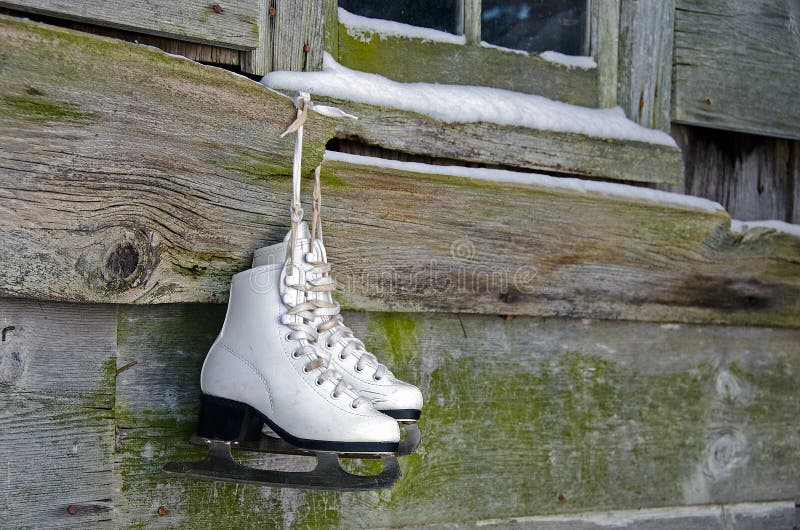 Ice skates hanging on barn stock image. Image of sport - 34903433