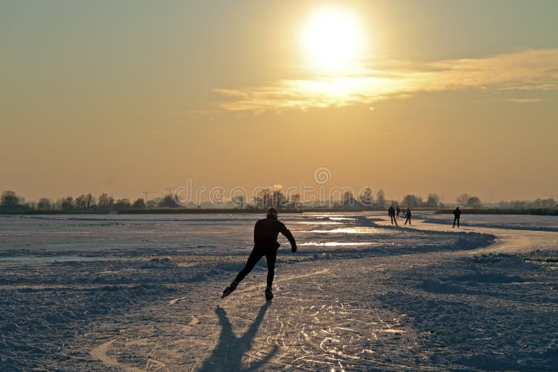 Ice Skating in the Netherlands at Sunset Stock Image - Image of ...
