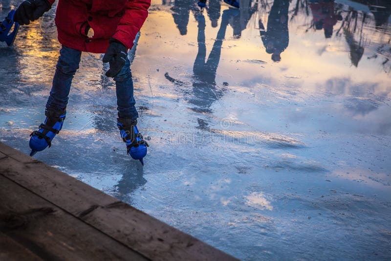 Ice Skating Rink with Visitors Close-up Reflection in Ice. Stock Image ...