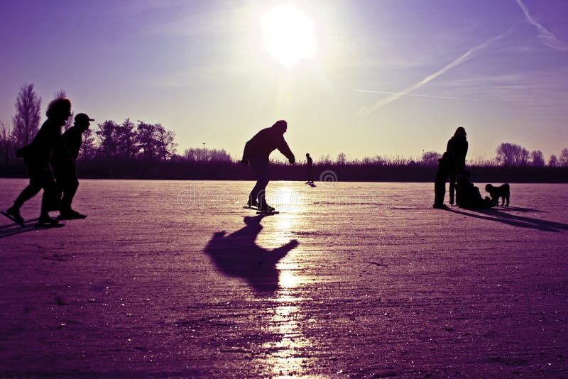 Ice Skating at Sunset in the Netherlands Stock Image - Image of water ...