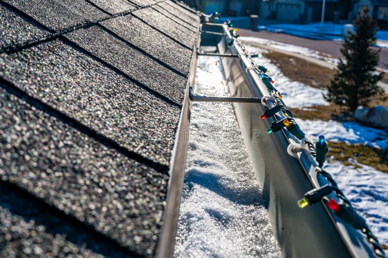 Ice and Snow Building Up Inside a Rooftop Gutter System on a ...