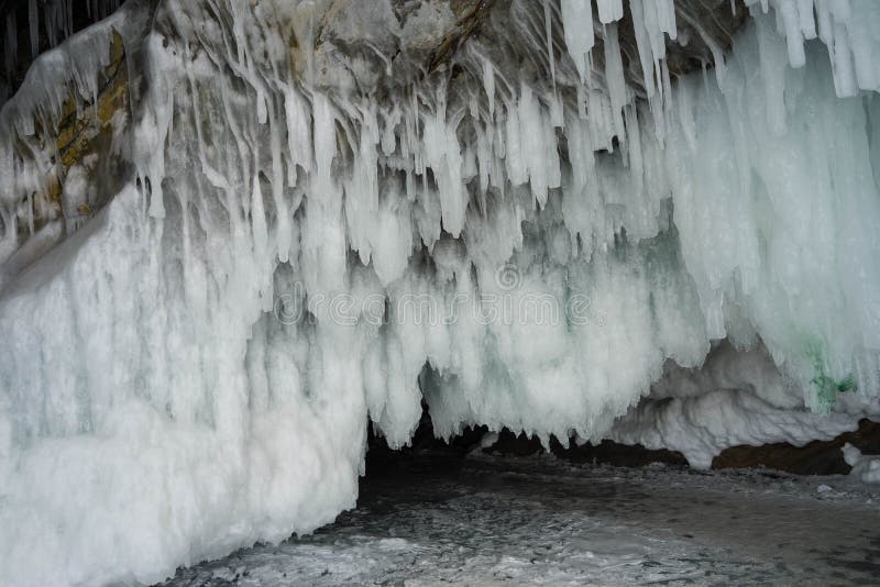 Ice and Snow Patterns and Icicles on Rocks and in a Cave Stock Photo ...