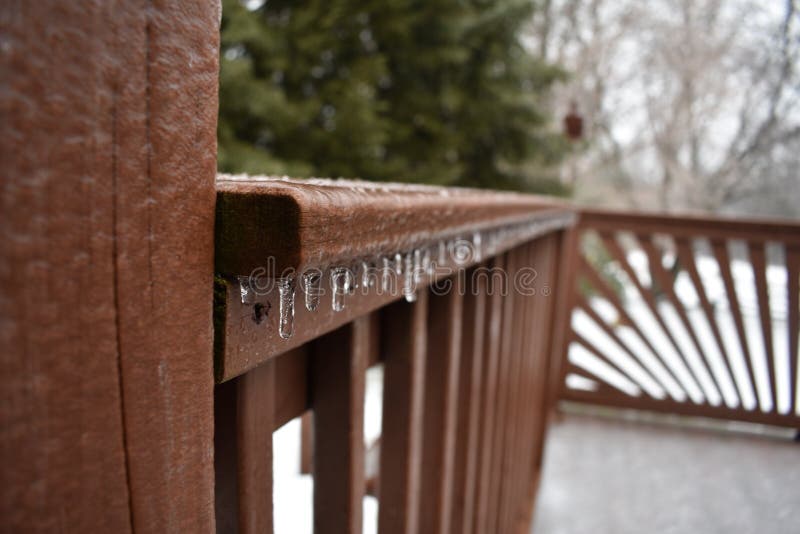Ice Storm Icicles Formed on a Deck Railing Stock Image - Image of froze ...
