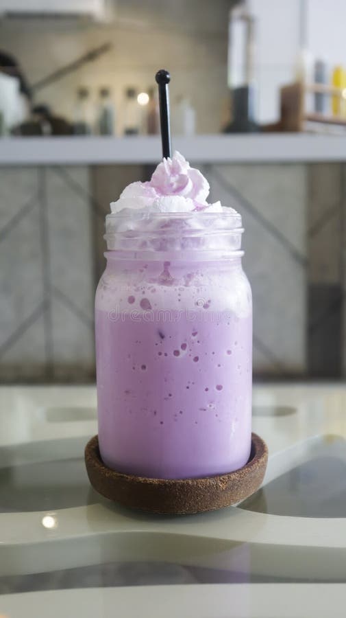 Ice Taro Latte with Whipped Cream Topping Stock Photo - Image of milky ...