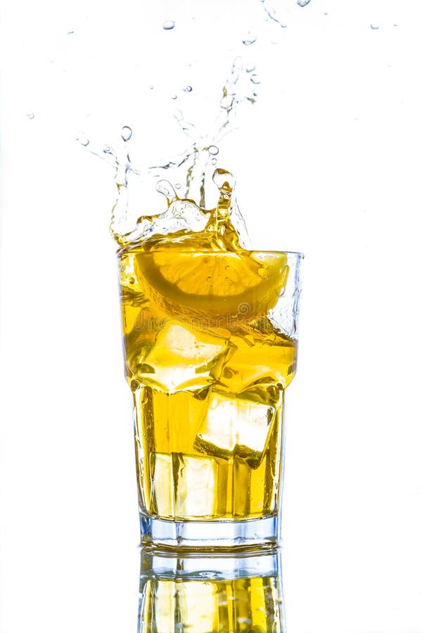 Ice tea with lemon splash stock photo. Image of bubble - 60884824