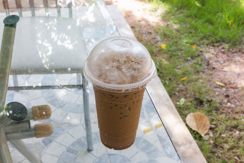 Ice Tea with Milk and Ice Coffee in Plastic Cap on Glass Table Stock ...