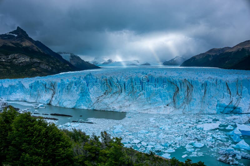 Ice Wall of a Glacier with Some Pieces of Ice in the Water in Front of ...