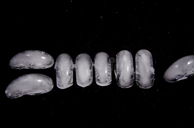 Ice is Water Frozen into a Solid State a Ice Cube`s Stock Image - Image ...