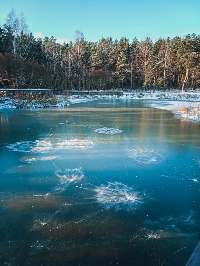 Ice on the winter pond stock image. Image of winter - 262902057
