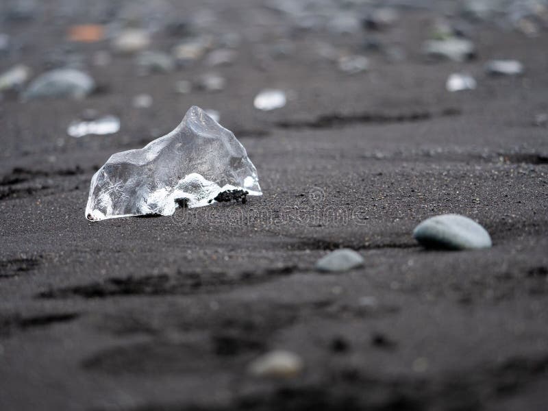 Iceberg Lying on a Sandy Diamond Beach Stock Photo - Image of serene ...