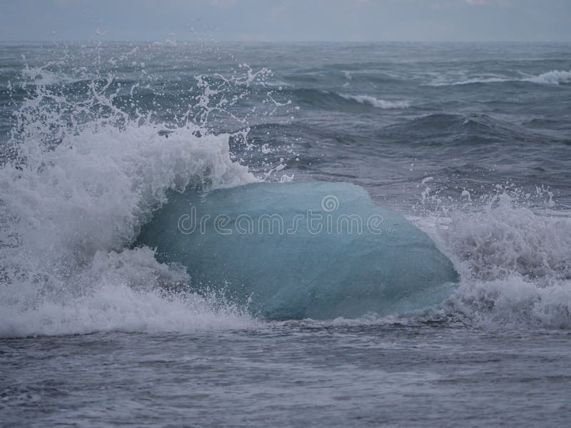 Iceberg in the Middle of the Ocean on Diamond Beach Stock Image - Image ...