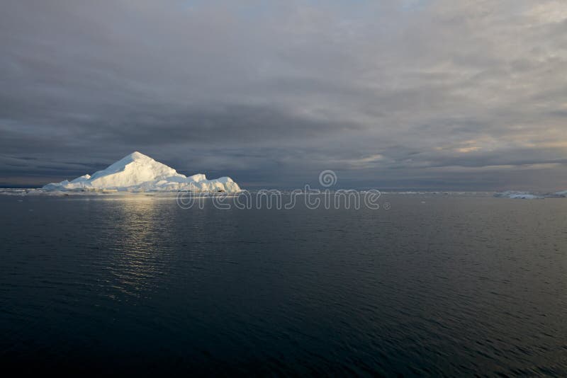 Iceberg in sunset stock image. Image of glacier, sunlight - 15974263