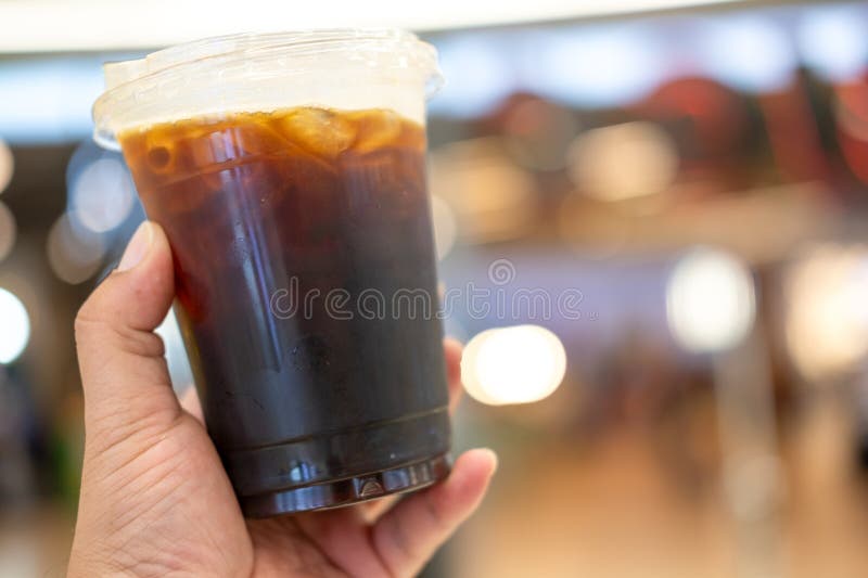 Iced Americano or Black Coffee on Hand Stock Image - Image of brown ...