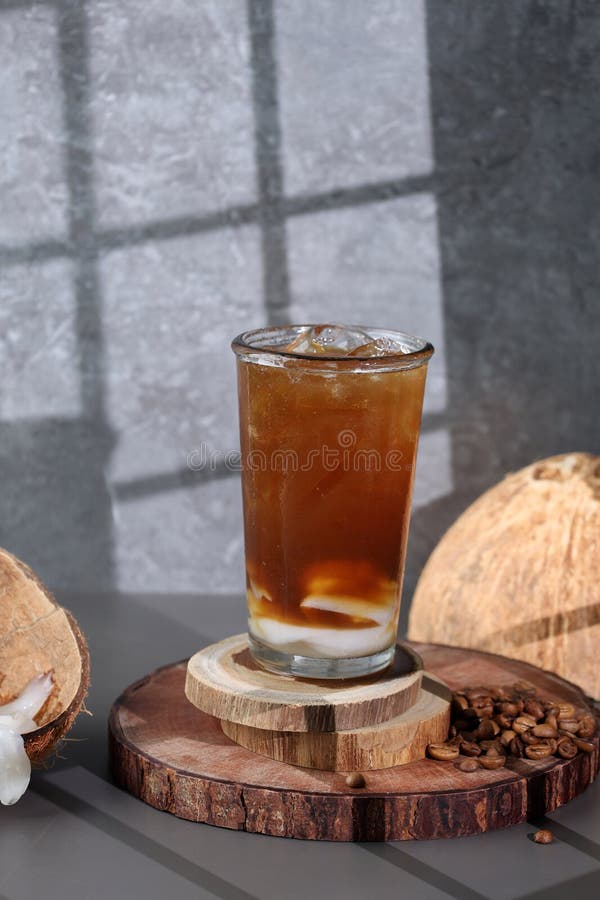 Iced Americano with Coconut Water and Shredded Coconut Slice Stock ...