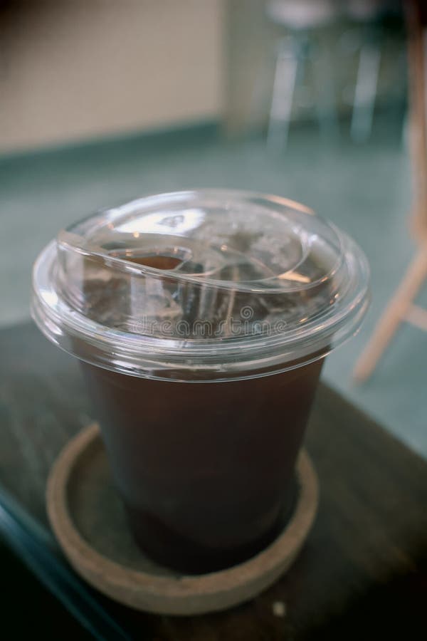 Iced Americano Coffee in a Disposable Plastic Cup. Stock Photo - Image ...