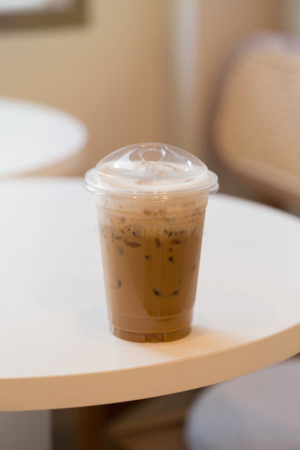 Iced cappuccino on a table stock image. Image of modern - 343352411