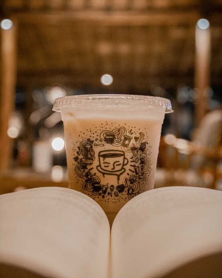 Iced coffee and book stock image. Image of coffee, book - 222240941