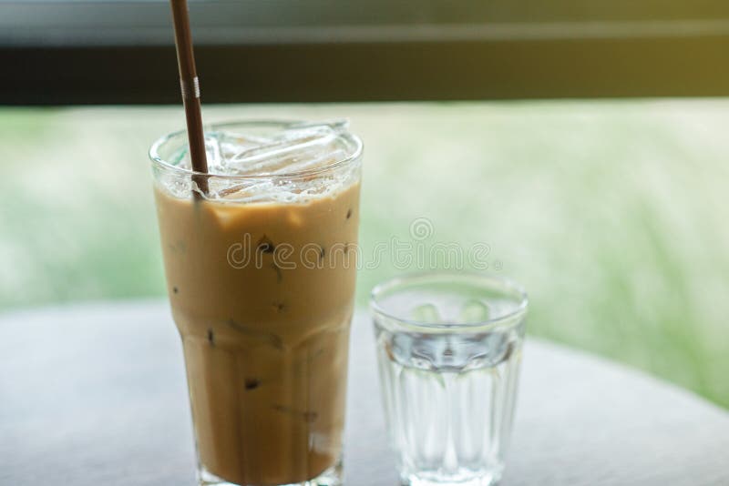 Iced Coffee and Cold Water Placed on the Table Stock Photo - Image of ...