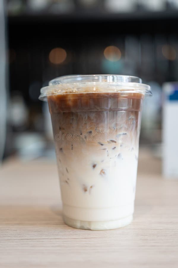 Iced Coffee Latte in Plastic Cup Stock Photo - Image of indoors, brown ...