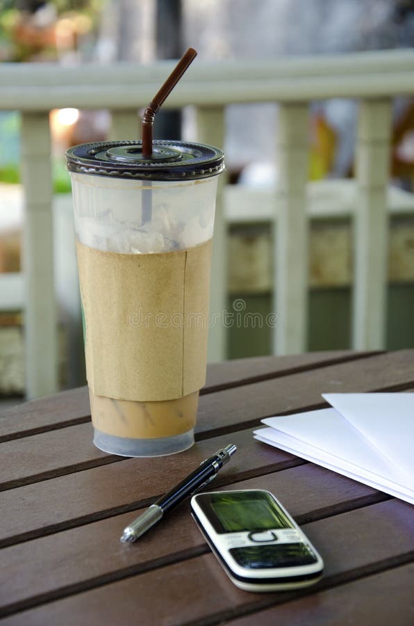Iced coffee and phone stock photo. Image of copy, dark - 36864774