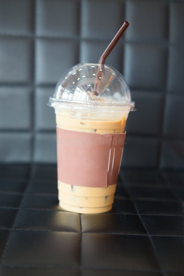 Iced Coffee in Plastic Cup in Cafe Put on Black Sofa Stock Image ...