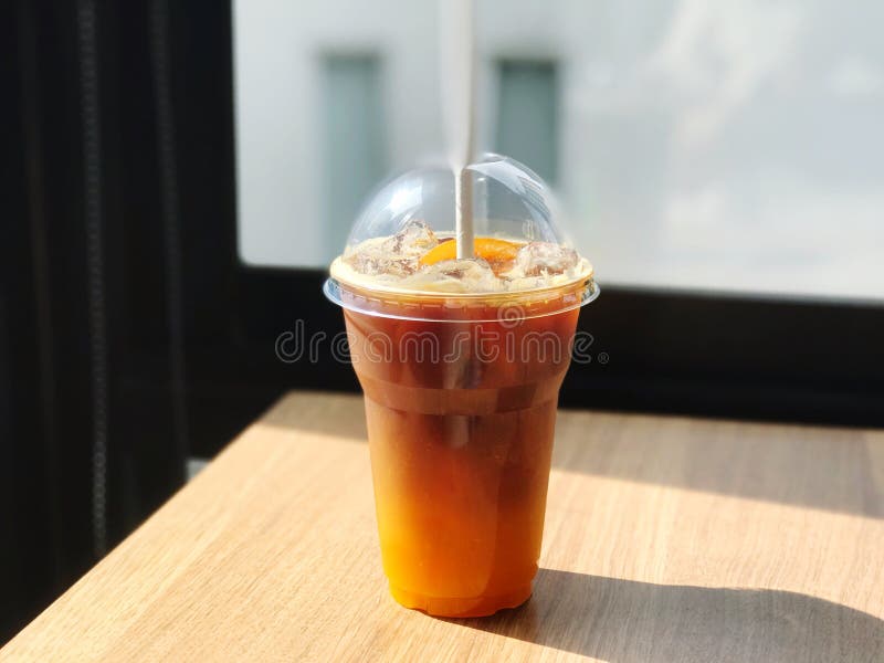 Iced Coffee in Plastic Cup on Wooden Table in Coffee Shop. Stock Image ...