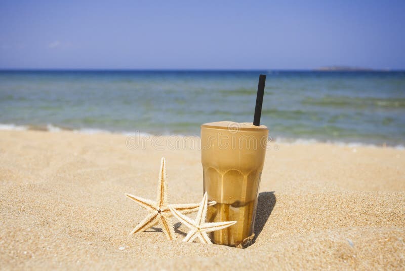 Iced Coffee on a Sandy Beach Background Stock Photo - Image of cream ...
