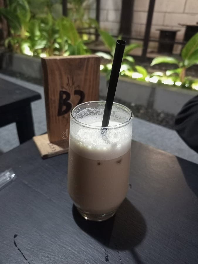 Iced Coffee with Straw on Table Stock Photo - Image of beans, shop ...