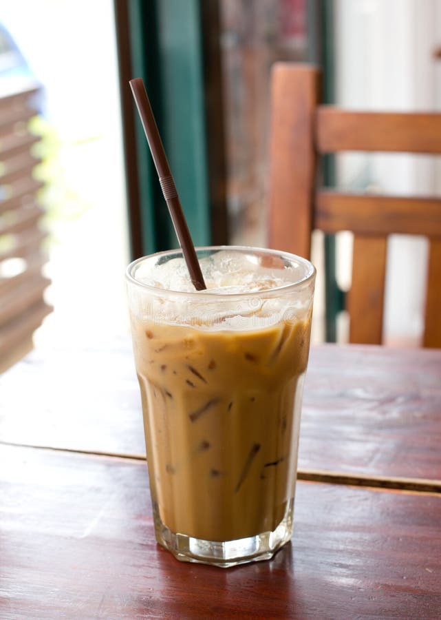Iced coffee on wood table stock image. Image of espresso - 38555207