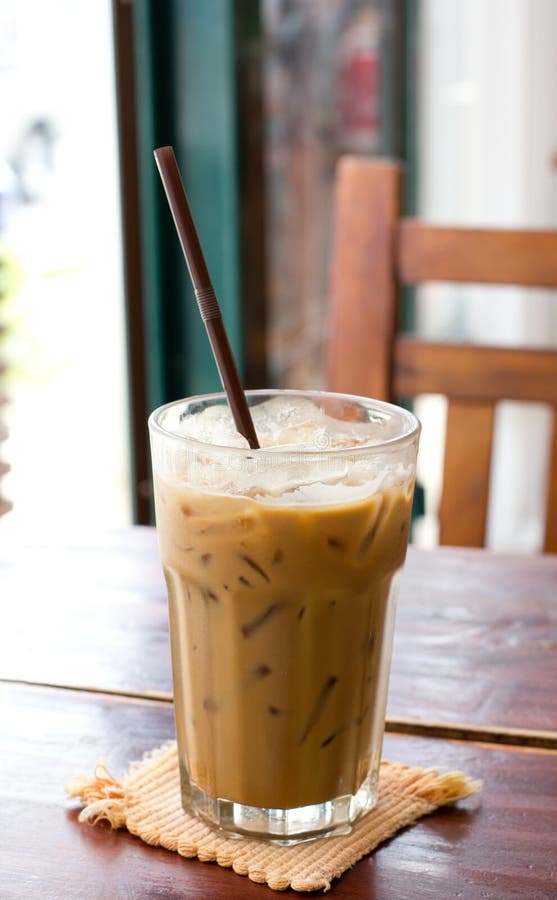 Iced coffee on wood table stock image. Image of dessert - 38555151