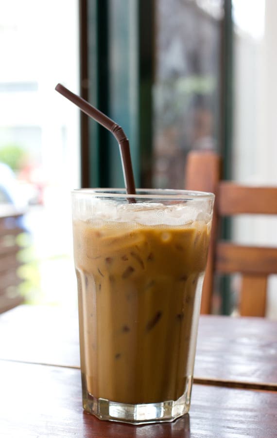 Iced coffee on wood table stock image. Image of espresso - 38555207