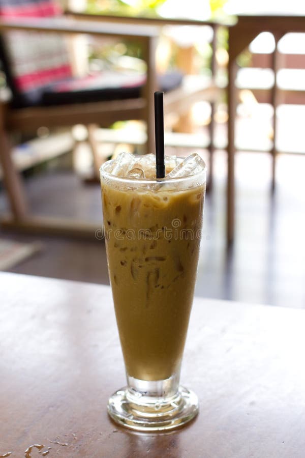 Iced coffee on wood table stock image. Image of espresso - 46020387