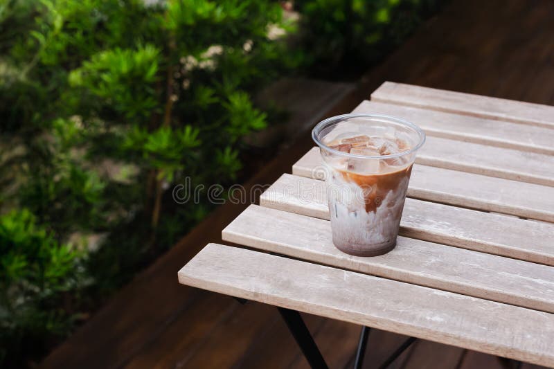 Iced Coffee on Wood Table Outdoors at Cafe. Stock Photo - Image of ...