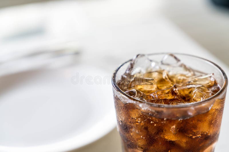 Iced cola on the table stock image. Image of refreshment - 93678329