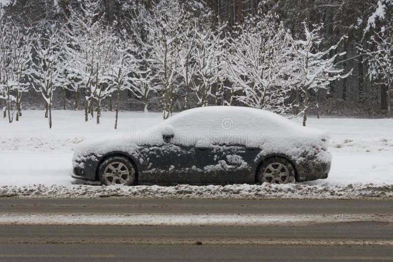 Iced and Covered with a Thick Layer of Snow Car Parked on the Side of ...
