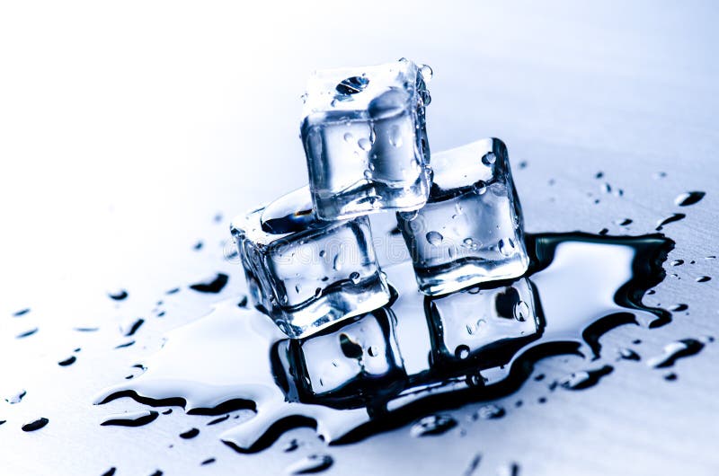 Iced Cubes Melting on a Blue Table with Reflection. Water. Melting of ...